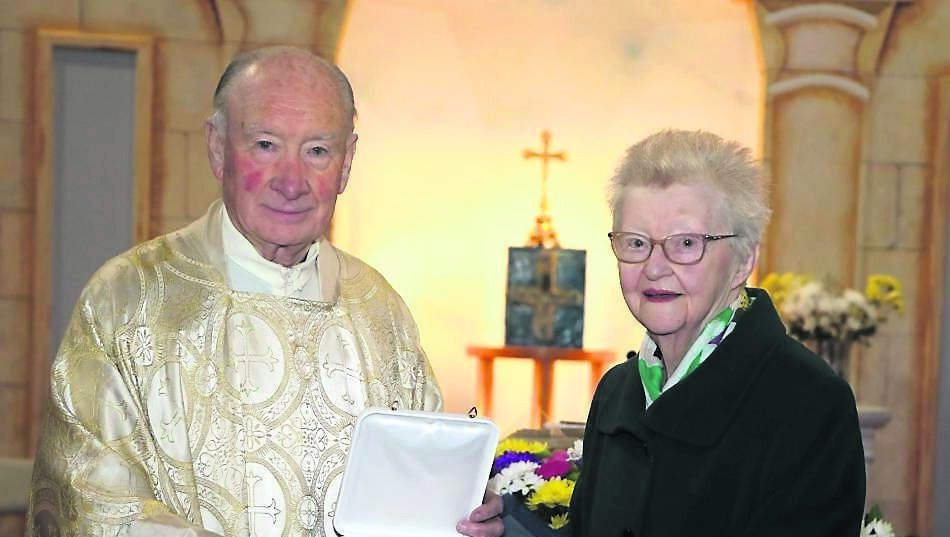 Presentation made to woman for outstanding service to local church ...